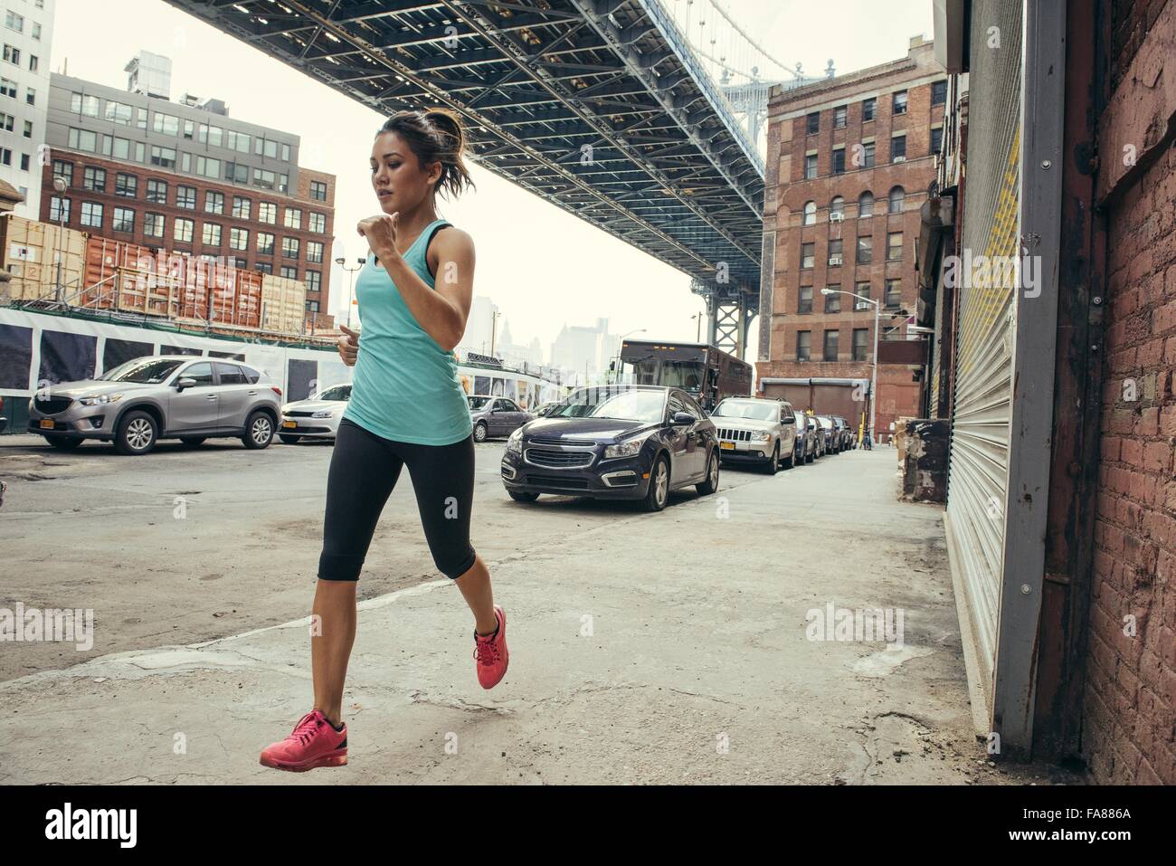 Young female runner running, New York, USA Stock Photo - Alamy