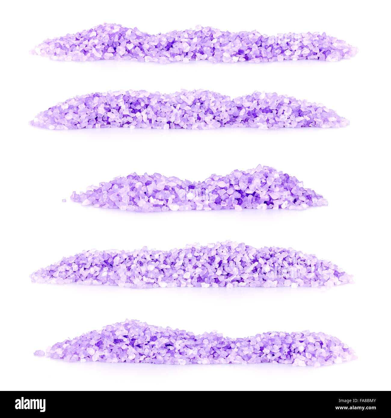 Set pile of lavender bath salt on white background Stock Photo - Alamy