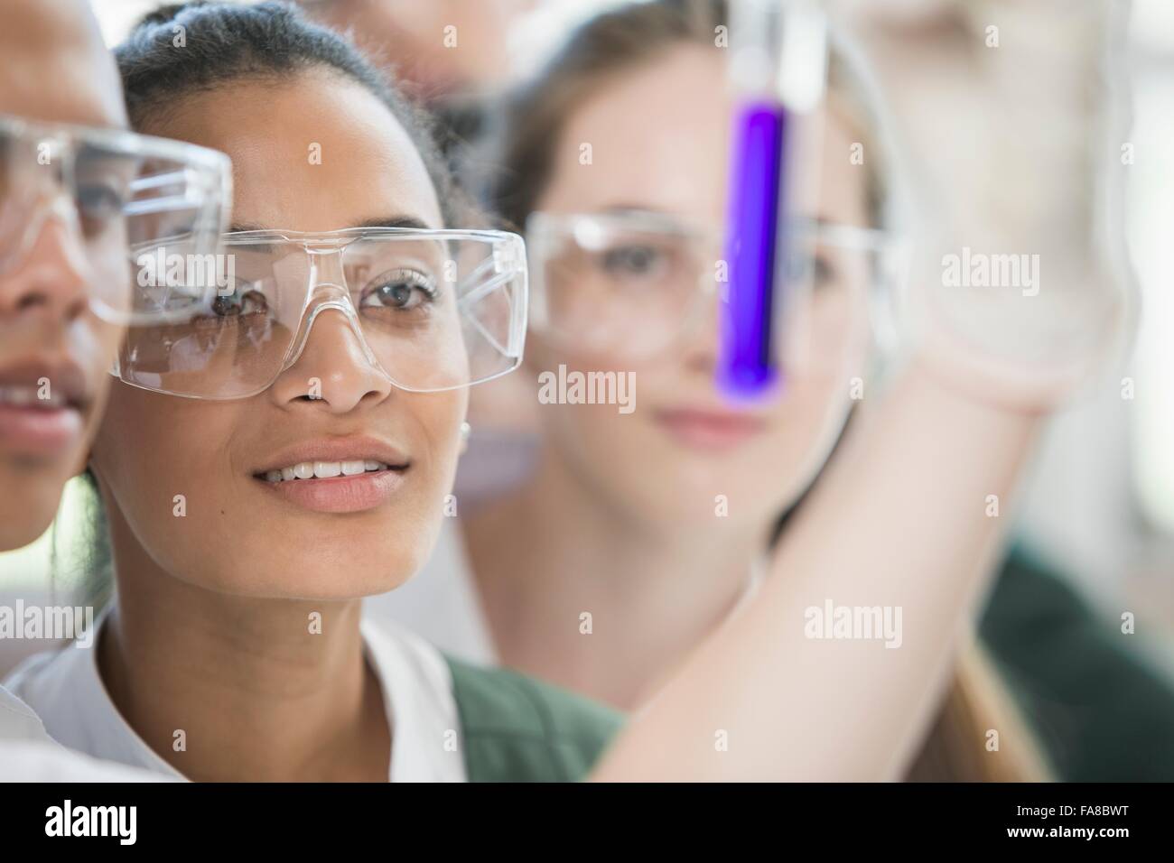 Students conducting experiment in lab Stock Photo - Alamy