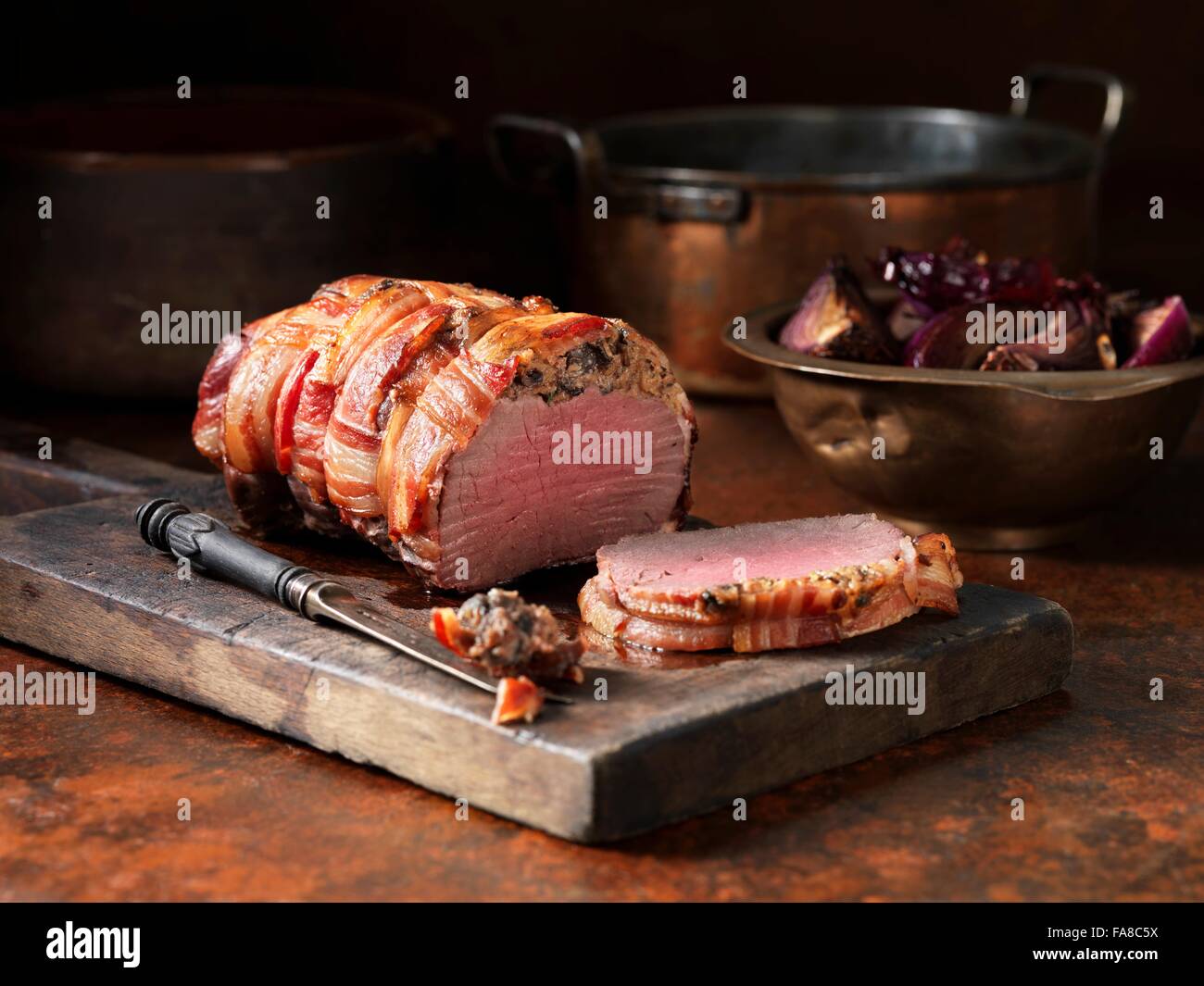 Venison Joint with Mushroom Duxelle and Streaky Bacon Stock Photo - Alamy