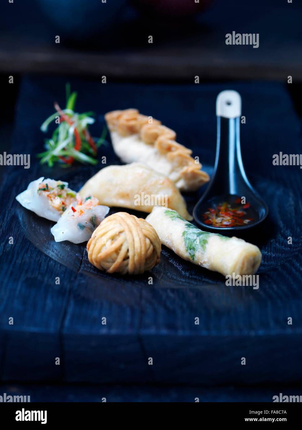 Selection plate of dim sum and dipping sauces, sweet chilli sauce Stock ...