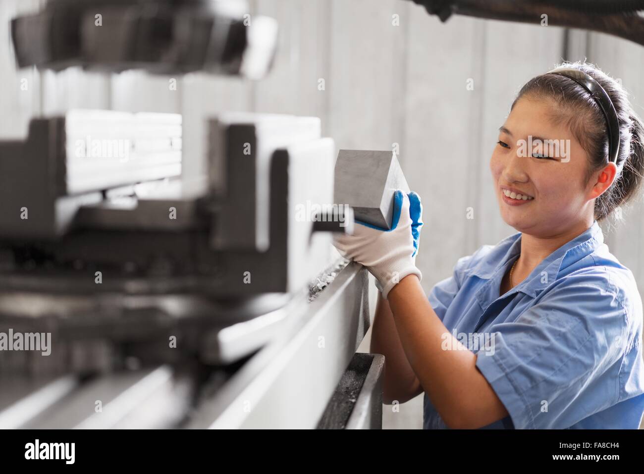 Female factory worker in crane factory, China Stock Photo - Alamy