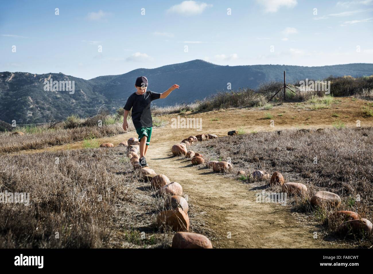 Boy stepping stones hi-res stock photography and images - Alamy