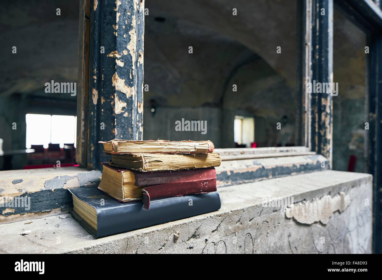 Old books on dilapidated window ledge, Tenby, Pembrokeshire, Wales ...