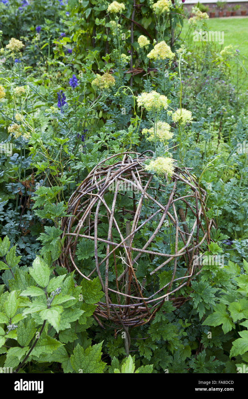 Spherical willow plant support at Lacock Abbey, Wiltshire, in June ...