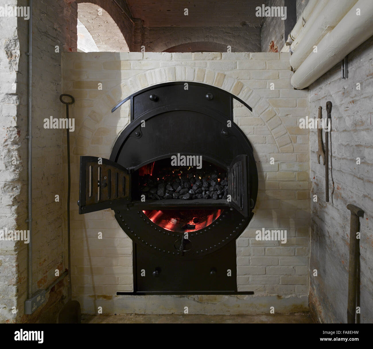 The boiler set into the wall of the Boiler Room in the Basement at ...