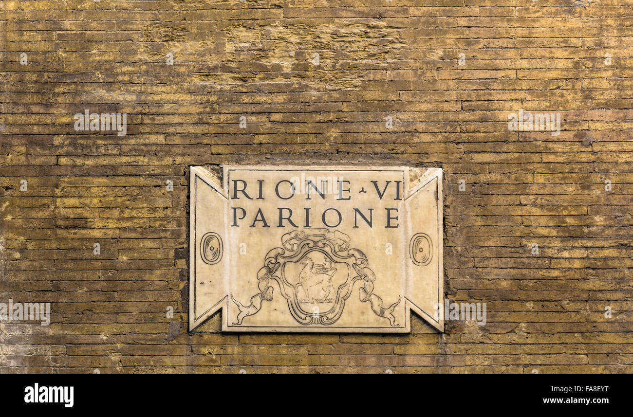 The plate that indicates the name of medieval district of Rome. In this ...