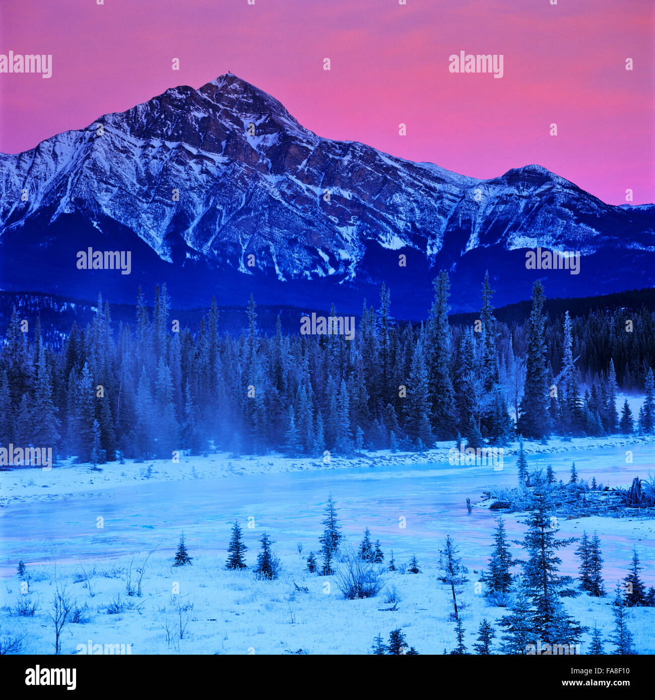 Pyramid mountain and Athabasca River in winter in Jasper National Park ...
