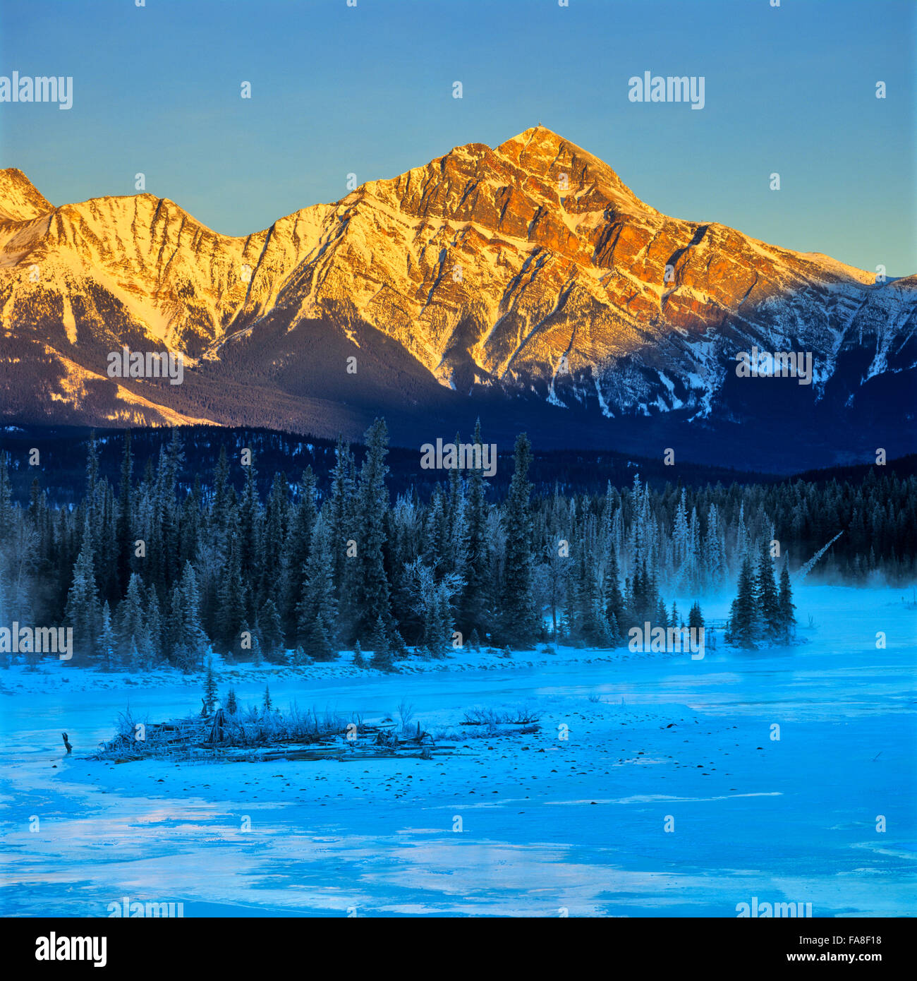 Pyramid mountain and Athabasca River in winter in Jasper National Park ...