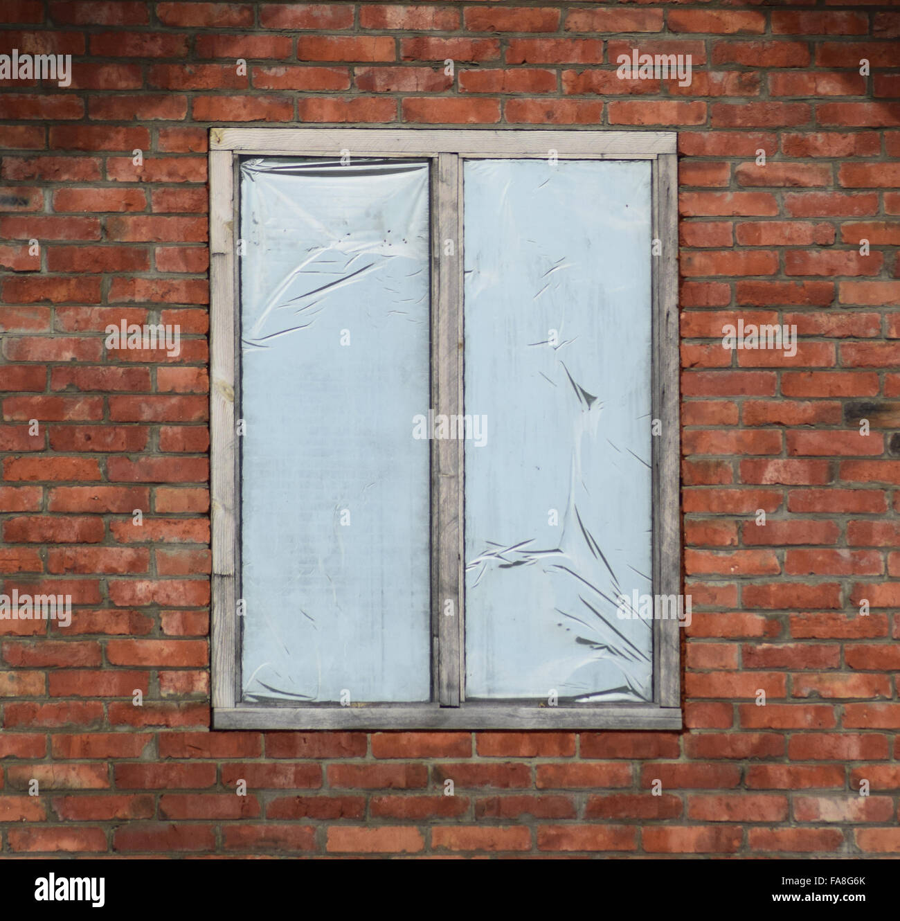 Window in a brick wall. Construction of the house Stock Photo - Alamy