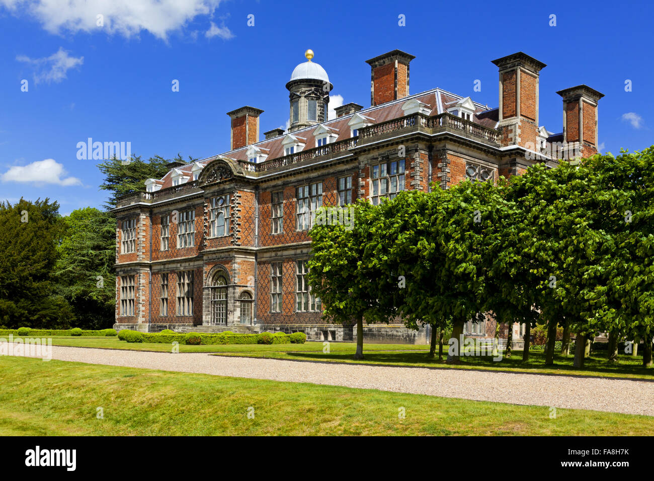 The south front of Sudbury Hall, Derbyshire, with trees in the ...