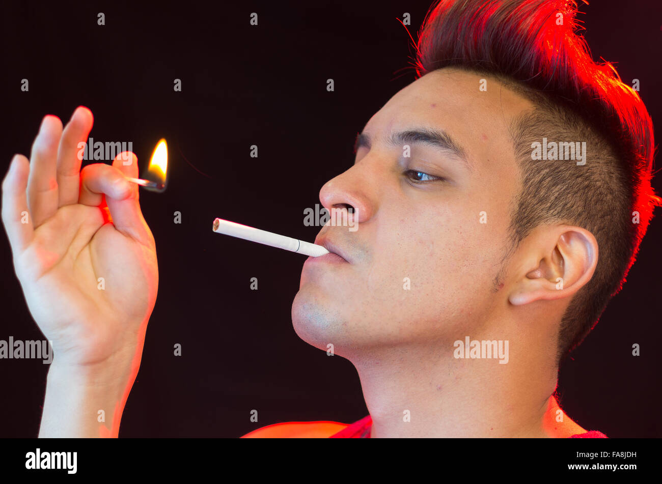 Hispanic male headshot posing with serious facial expression and ...