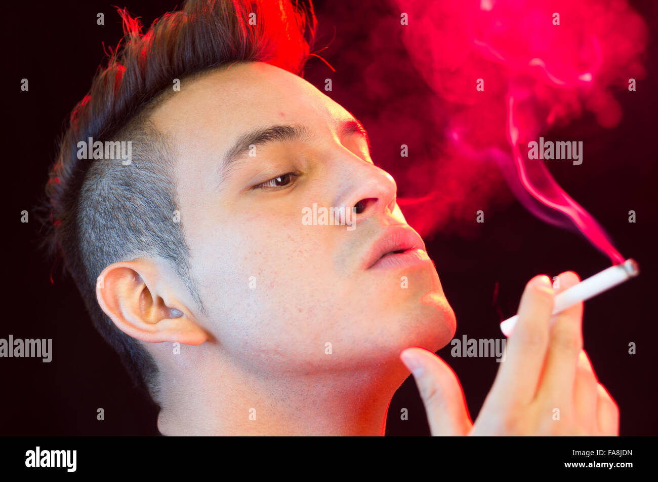 Hispanic male headshot posing with serious facial expression and ...