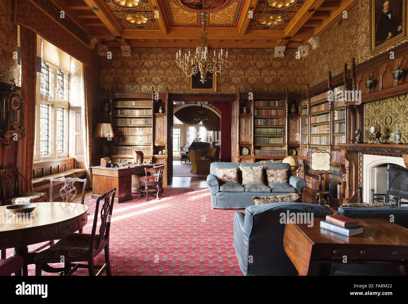 The Library at Knightshayes Court, Devon. The bookcases are in a Gothic ...