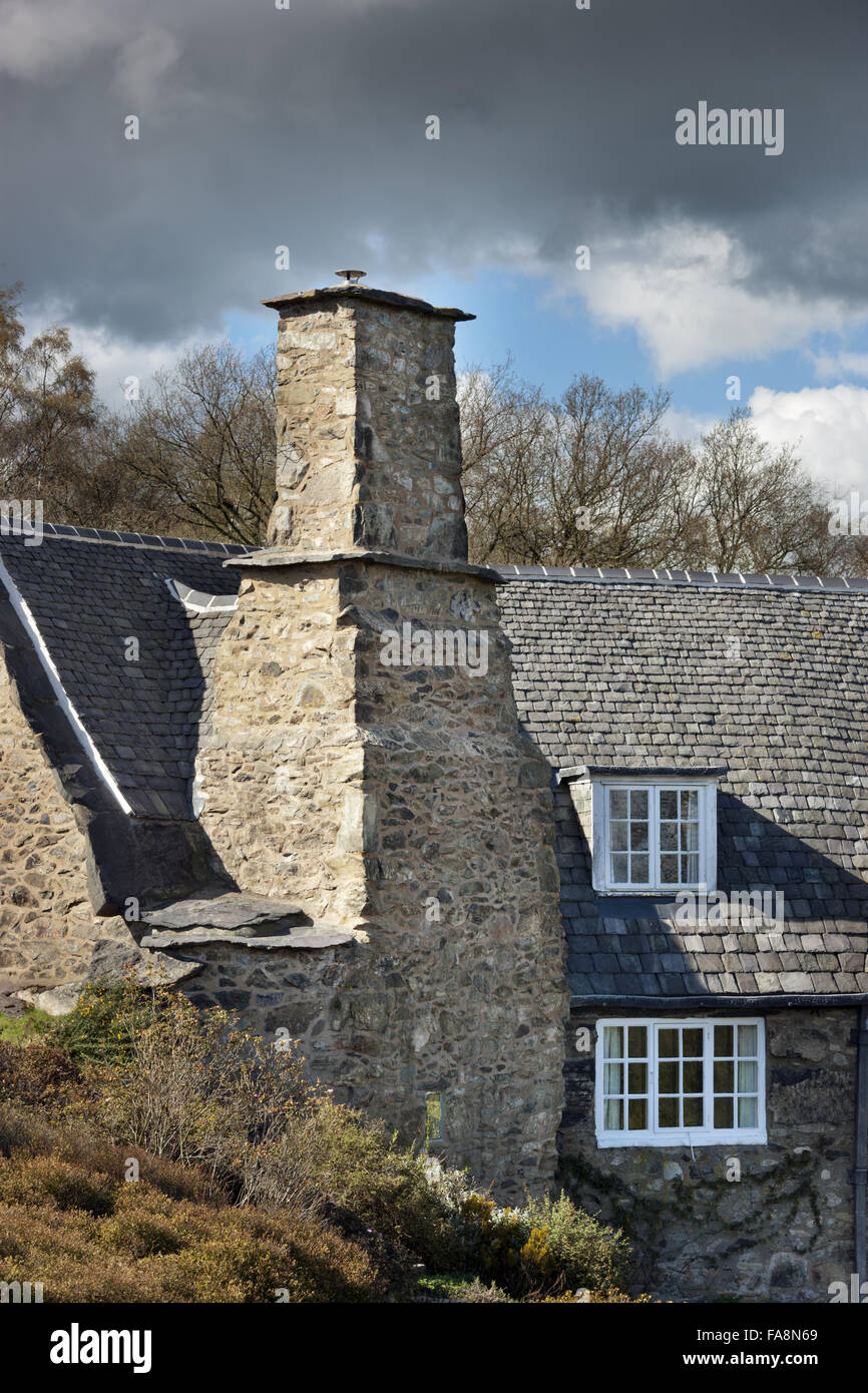 One of the massive rubble stone chimney stacks on the front of ...