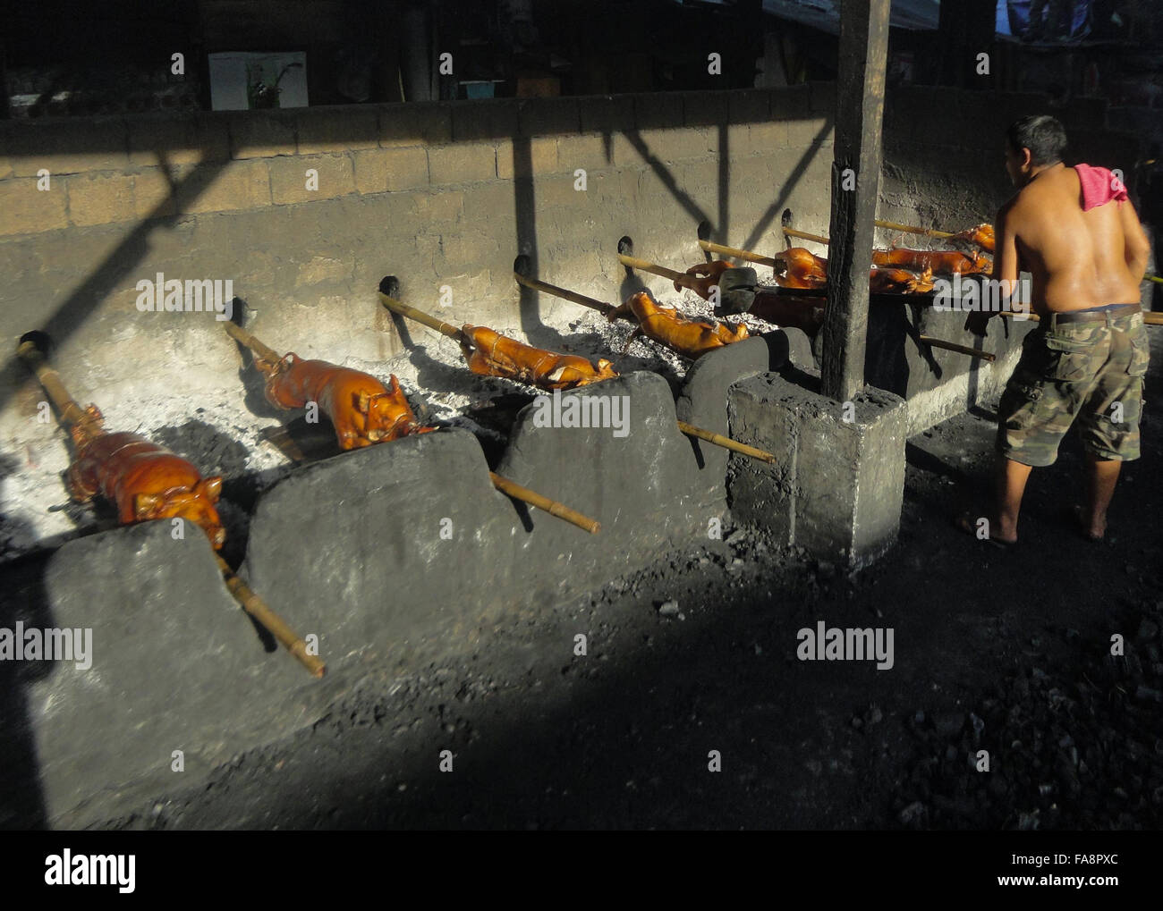 Quezon City, Philippines. 23rd Dec, 2015. A Filipino worker cleans a ...