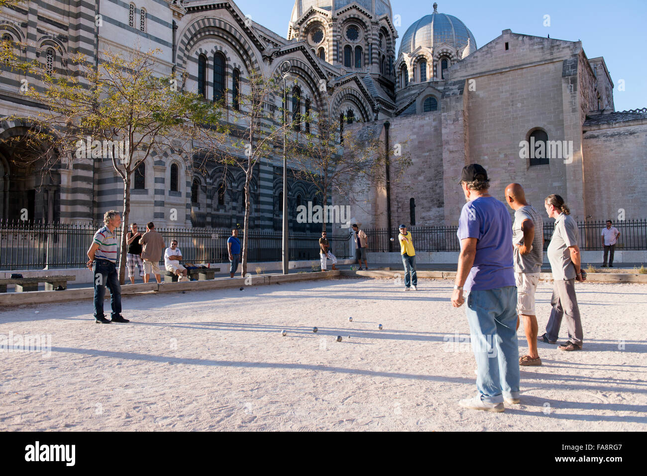 French men playing a game of petanque near the Marseille Cathedral in ...