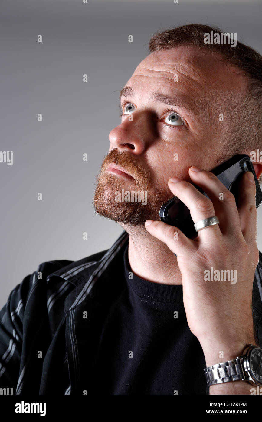 Man waiting on phone Stock Photo - Alamy