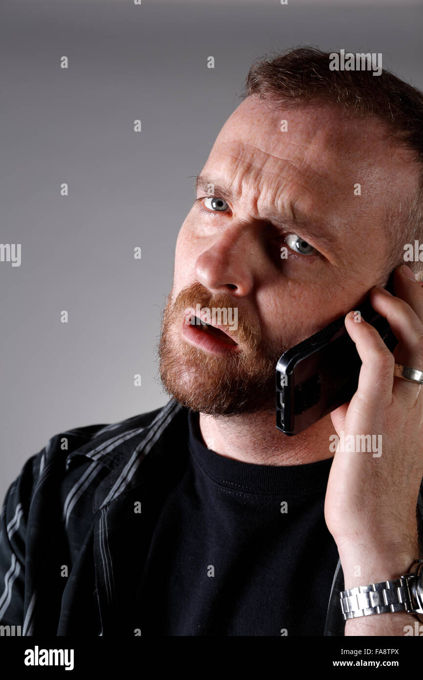 Man talking on phone Stock Photo - Alamy