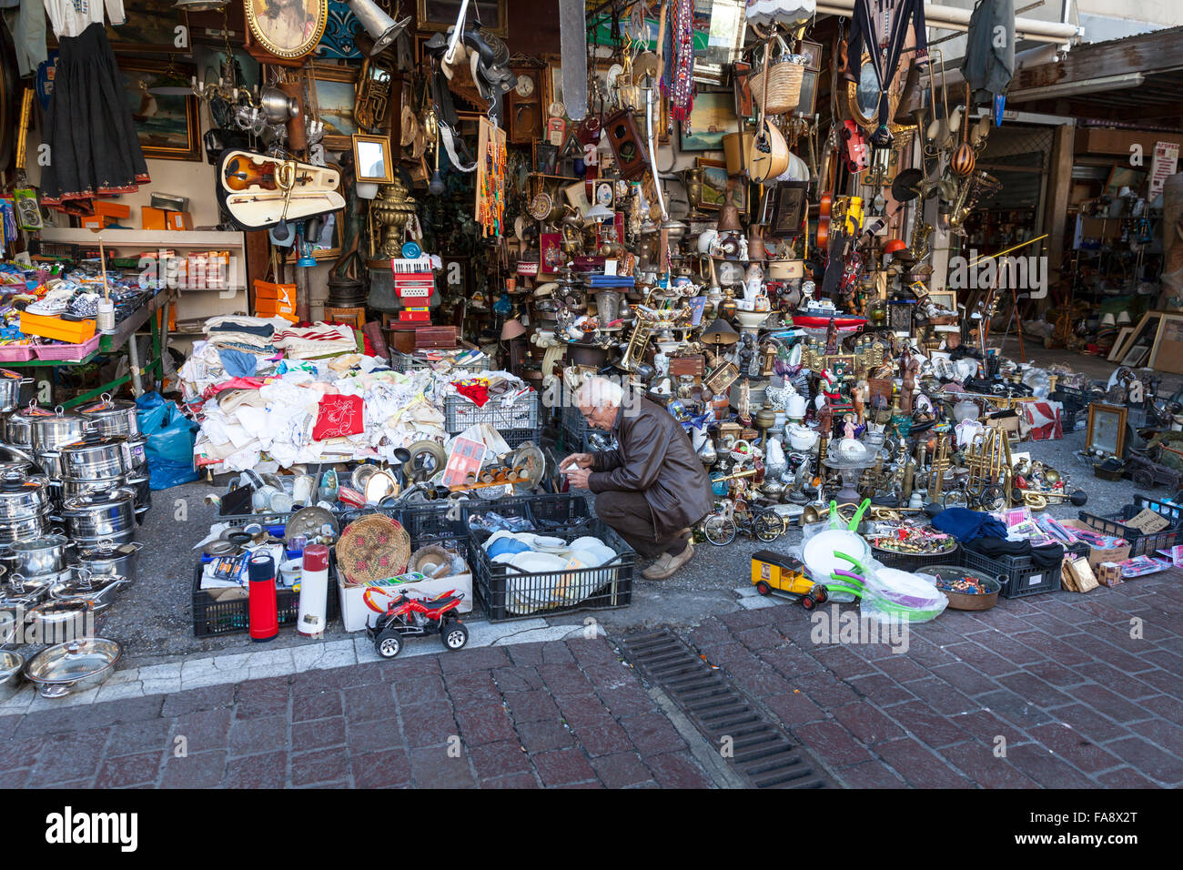 Antiques, musical instruments and household item shop display close to ...