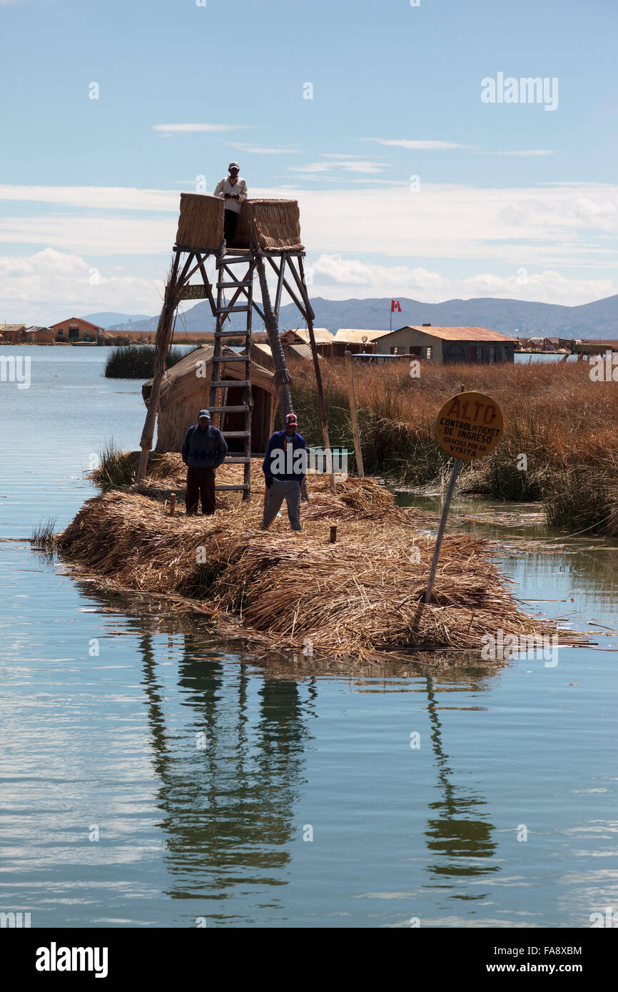 Entrance to the floating islands made of totora reeds, Los Uros, in ...
