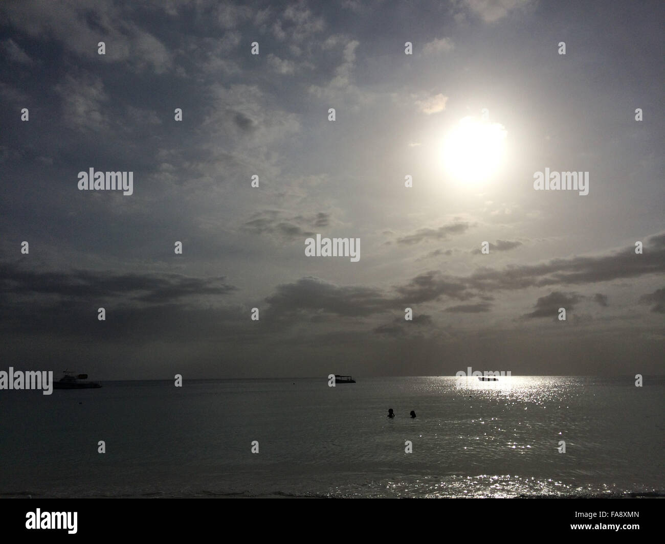 Beach sunset with clouds hi-res stock photography and images - Alamy