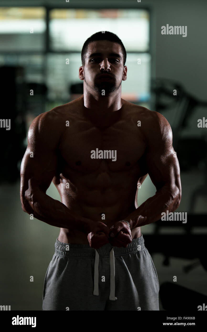 Athlete Muscular Brutal Bodybuilder Emotional Posing In A Dark Gym ...