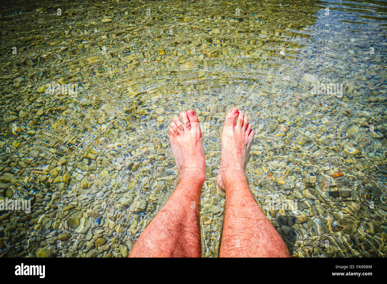 feet in summer by the water of a river in an inland lake Stock Photo ...