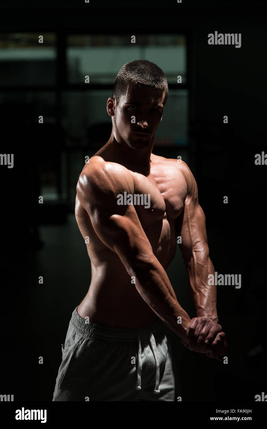 Athlete Muscular Brutal Bodybuilder Emotional Posing In A Dark Gym ...