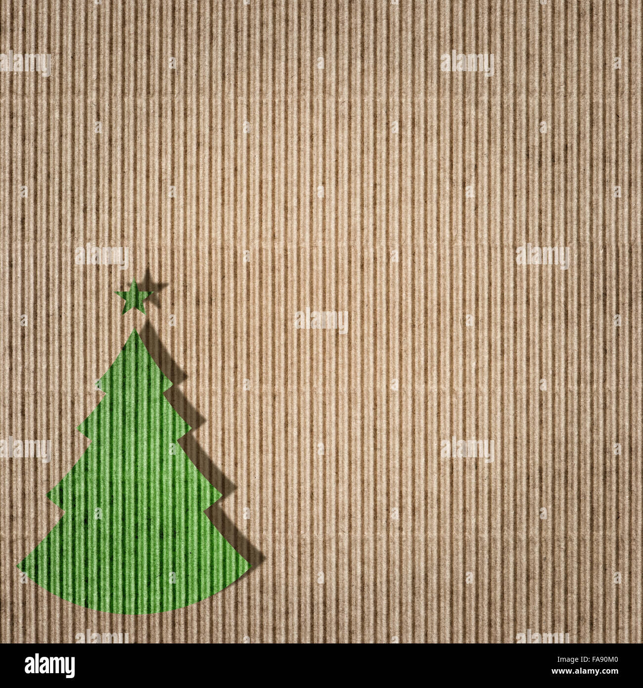 Green christmas tree on recycling paper. Environment friendly card ...