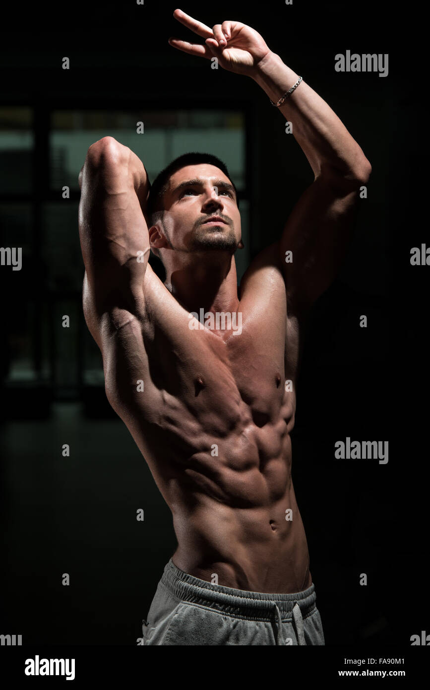 Athlete Muscular Brutal Bodybuilder Emotional Posing In A Dark Gym ...