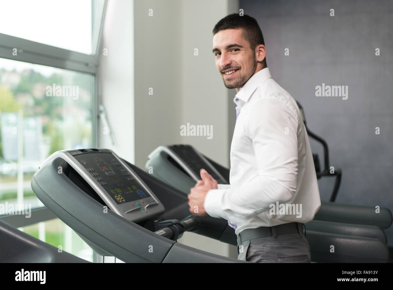 Businessman running on treadmill business hi-res stock photography and ...