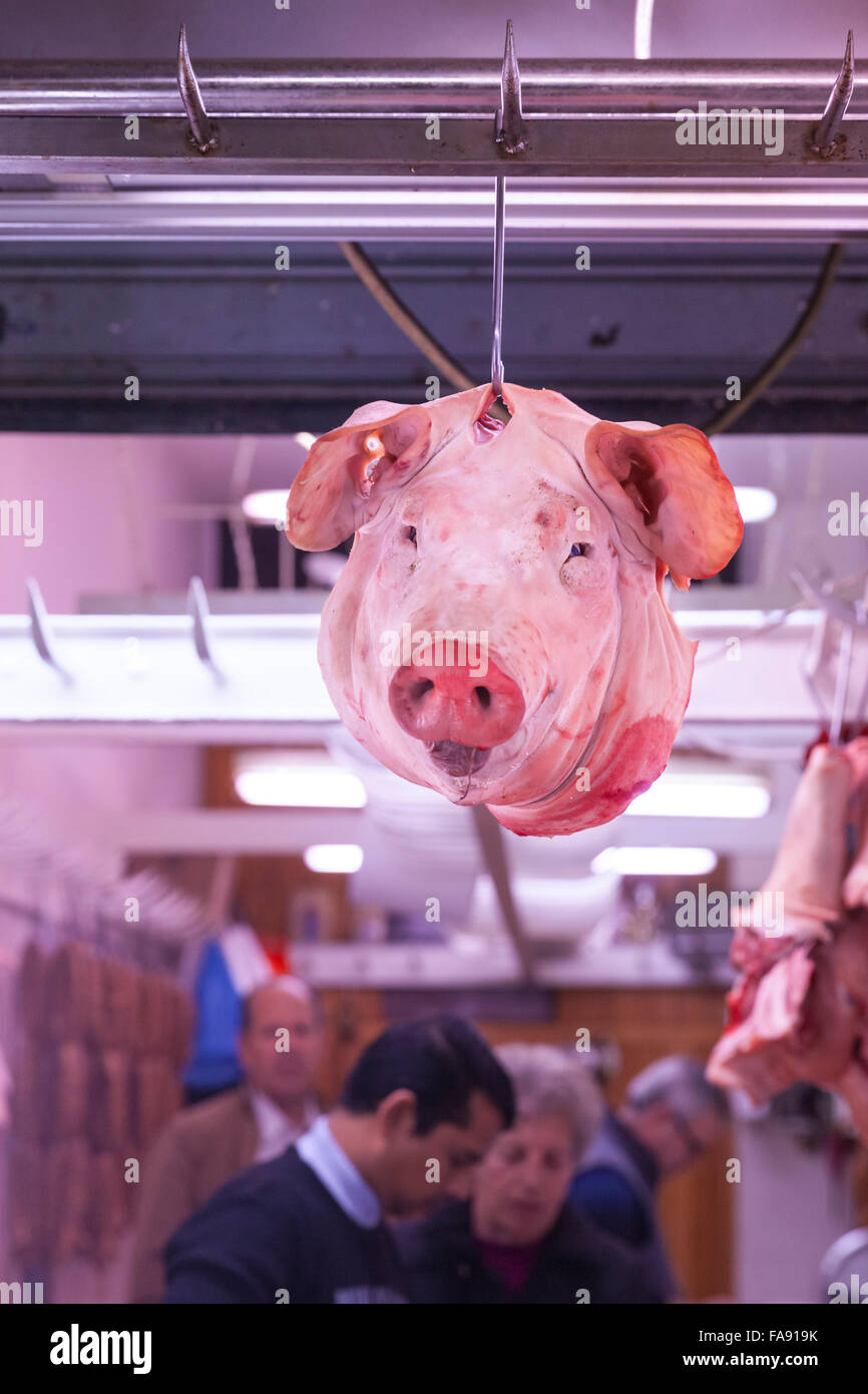 Pig's head hanging at a butcher's meat stall in Central Market, Athens ...
