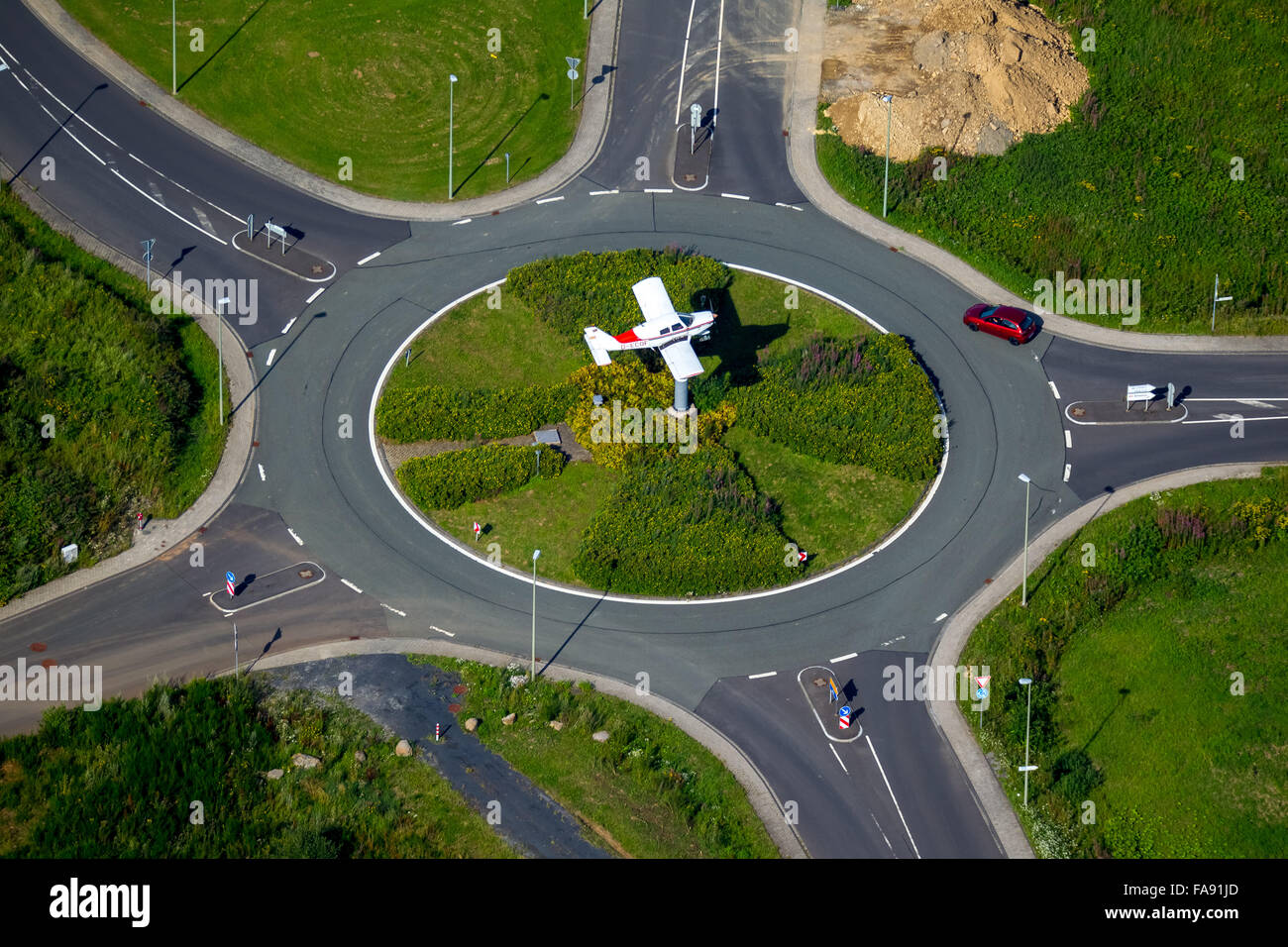 Roundabout, roundabout, sculpture in the form of a light aircraft Piper ...