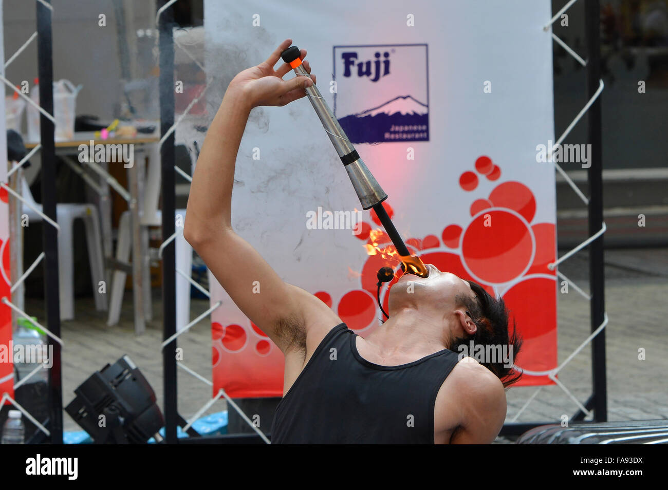 Fire eater at a street festival in Bangkok, Thailand Stock Photo - Alamy