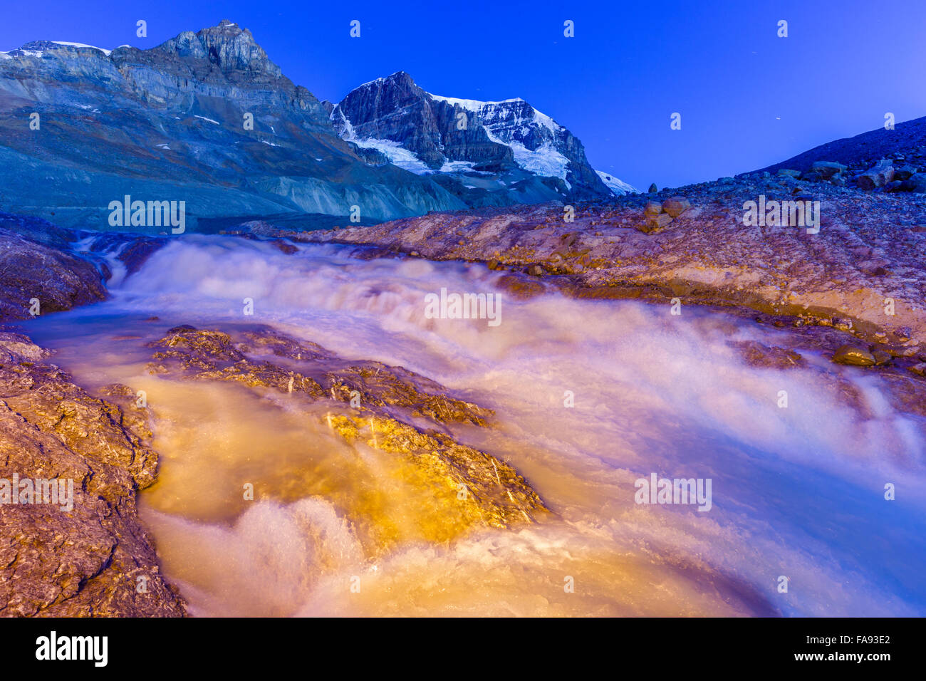 Glacial melt stream from Columbia Icefields with Mount Andromeda ...