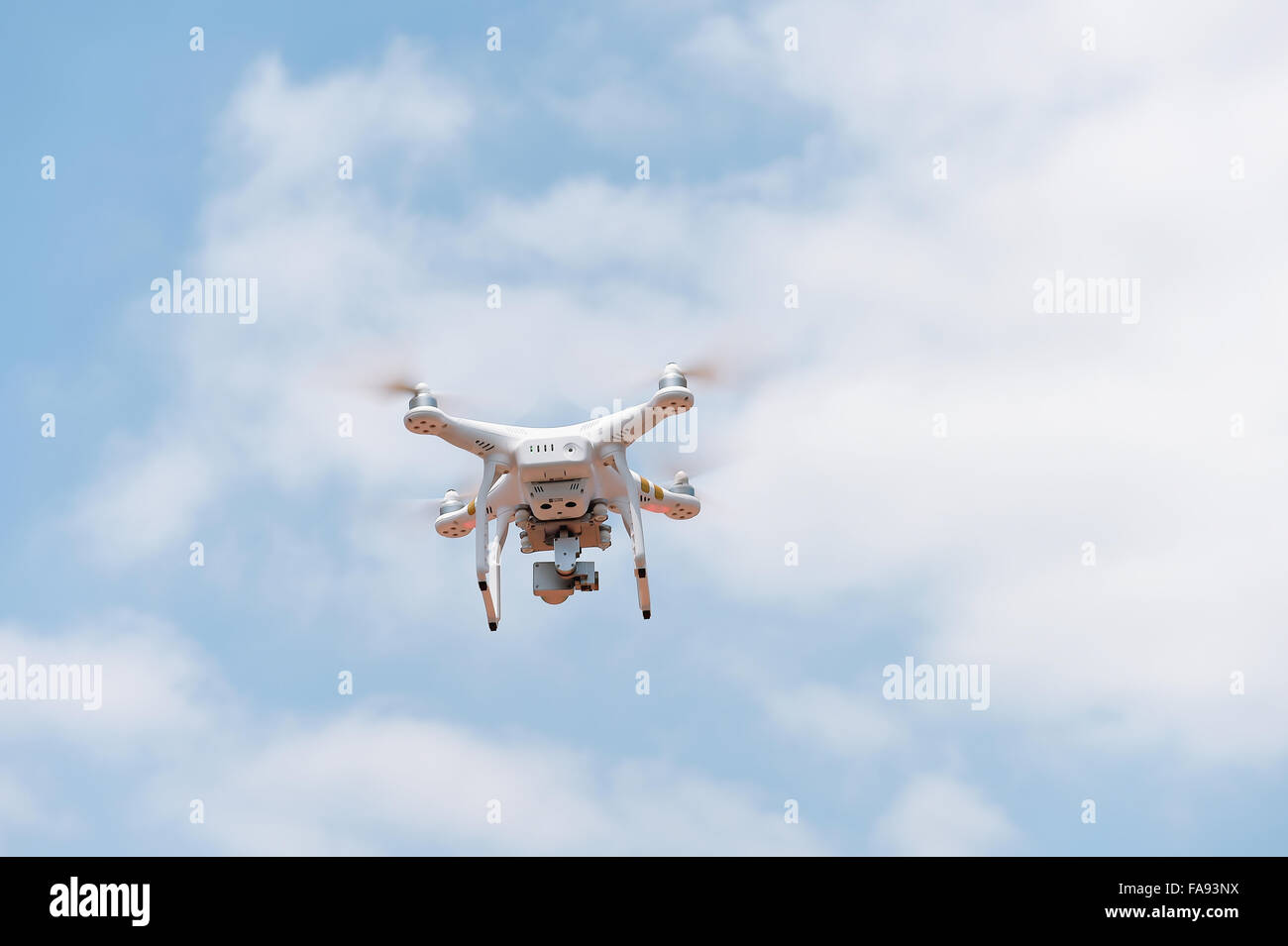 Quadcopter flying in the sky Stock Photo - Alamy