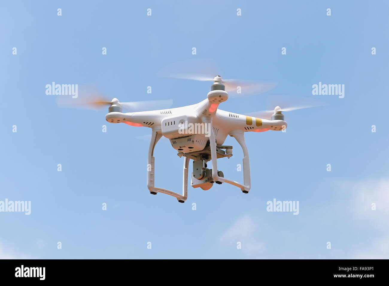 Quadcopter flying in the sky Stock Photo - Alamy