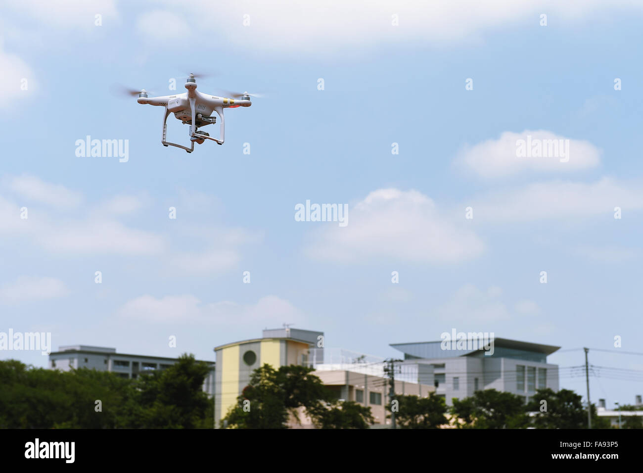 Quadcopter flying in the sky Stock Photo - Alamy