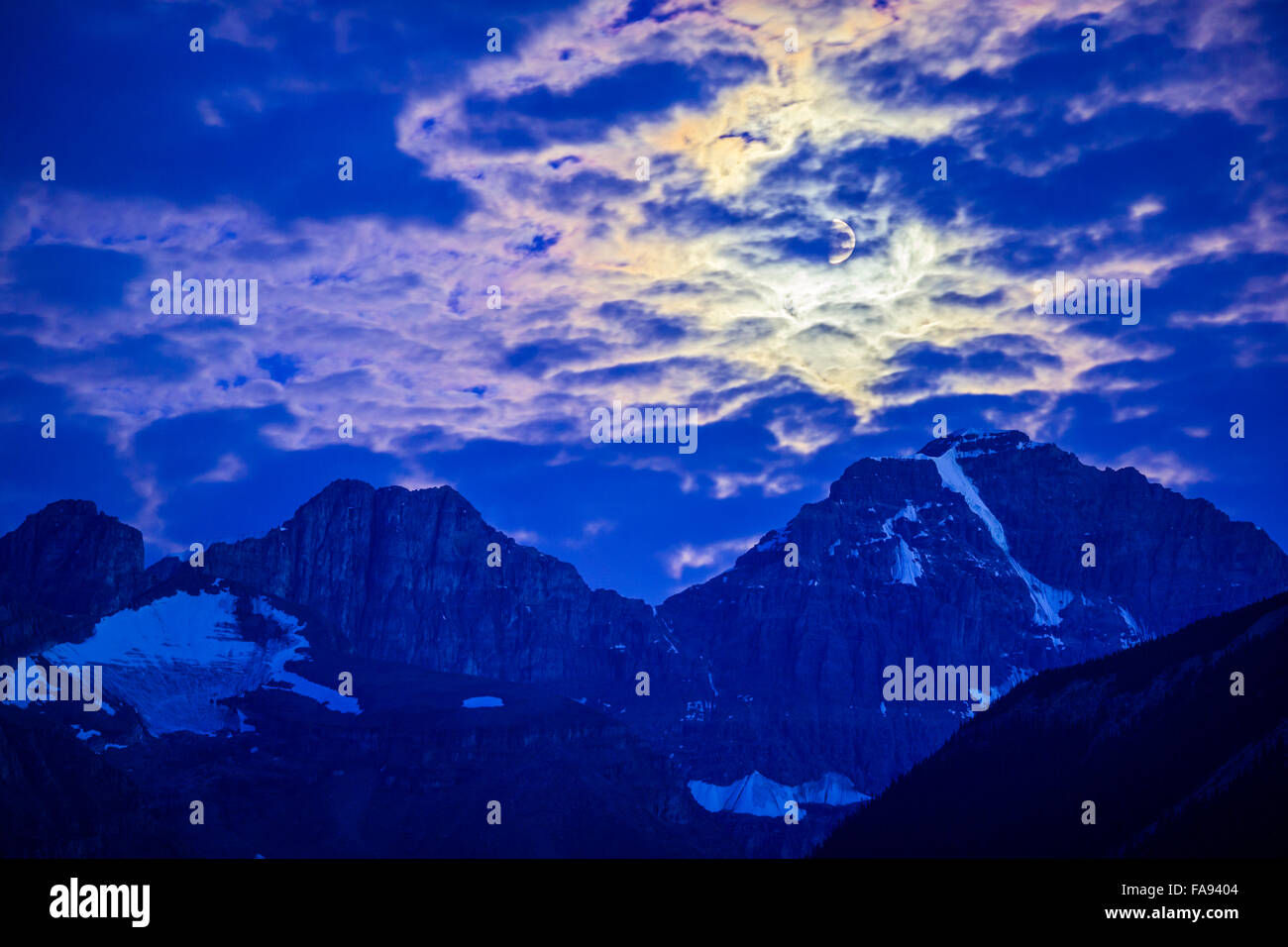 Moon rise over Mount Woolley and Mount Engelhard, Jasper National Park ...
