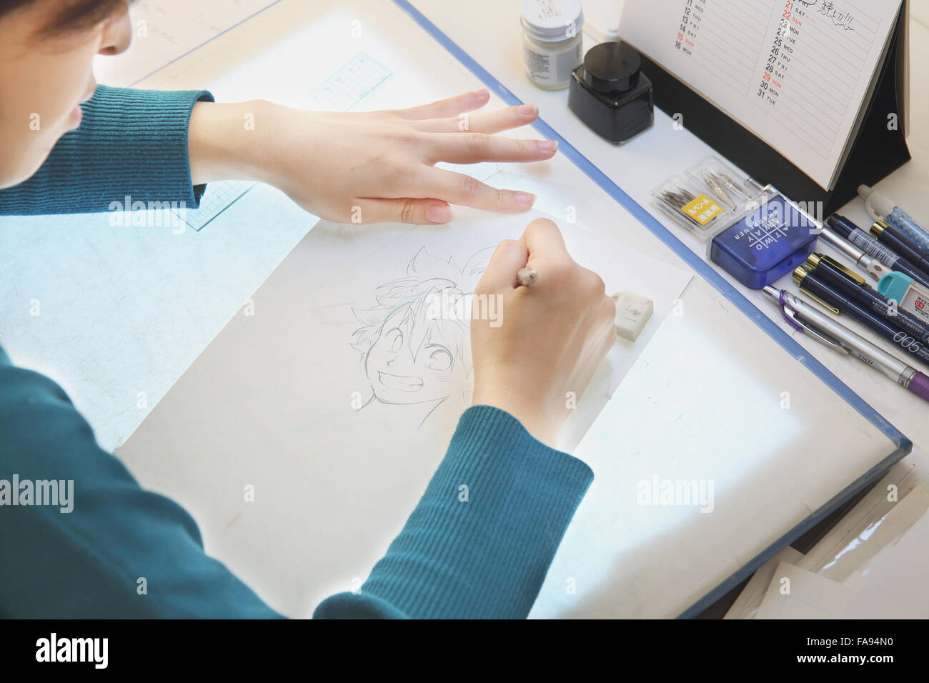 Japanese Manga artist working in the studio Stock Photo - Alamy