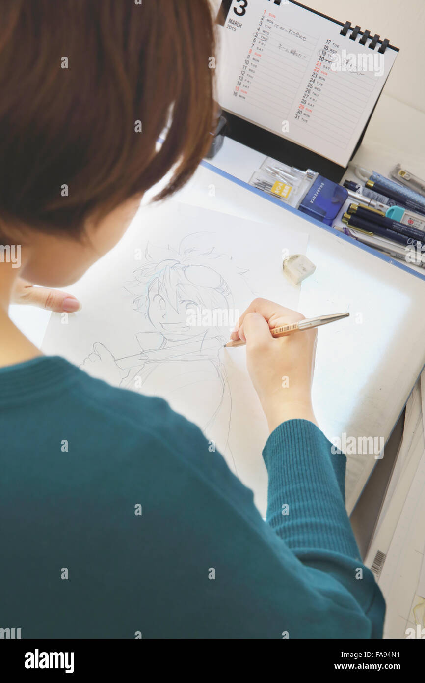 Japanese Manga artist working in the studio Stock Photo - Alamy
