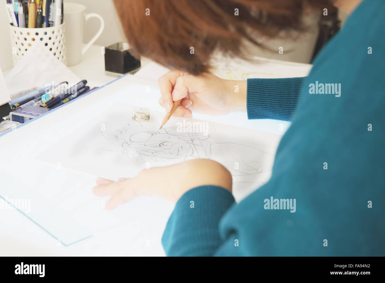 Japanese Manga artist working in the studio Stock Photo - Alamy