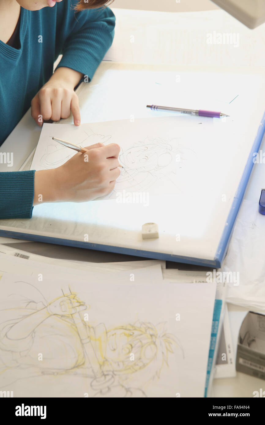 Japanese Manga artist working in the studio Stock Photo - Alamy