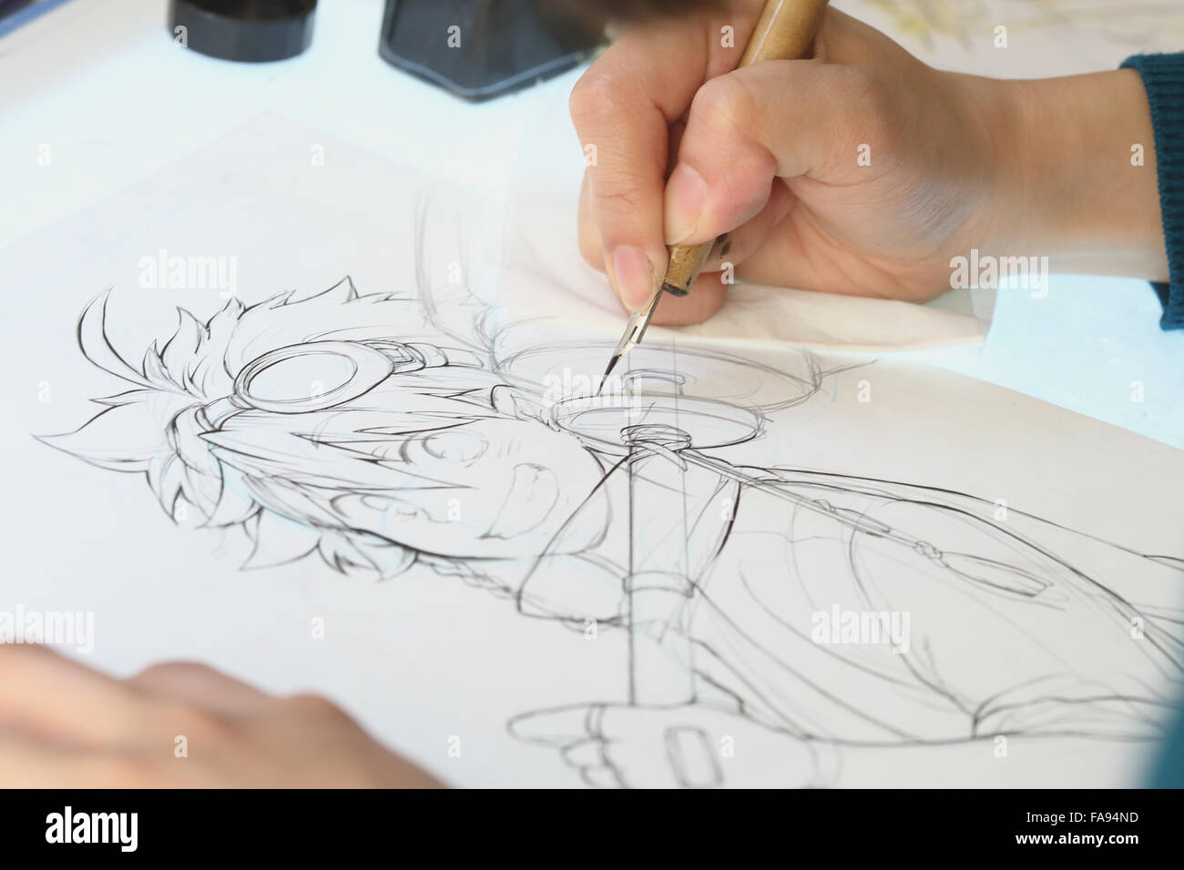 Japanese Manga artist working in the studio Stock Photo - Alamy