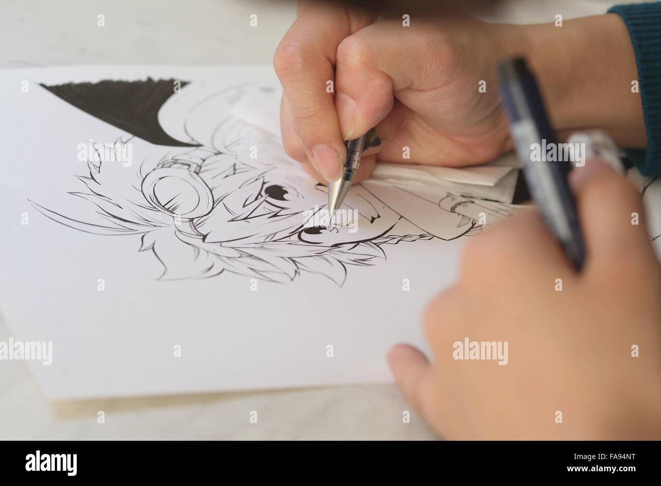 Japanese Manga artist working in the studio Stock Photo - Alamy