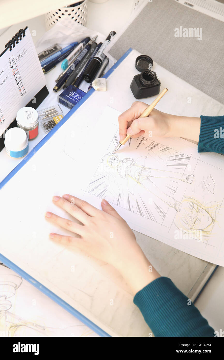 Japanese Manga artist working in the studio Stock Photo - Alamy