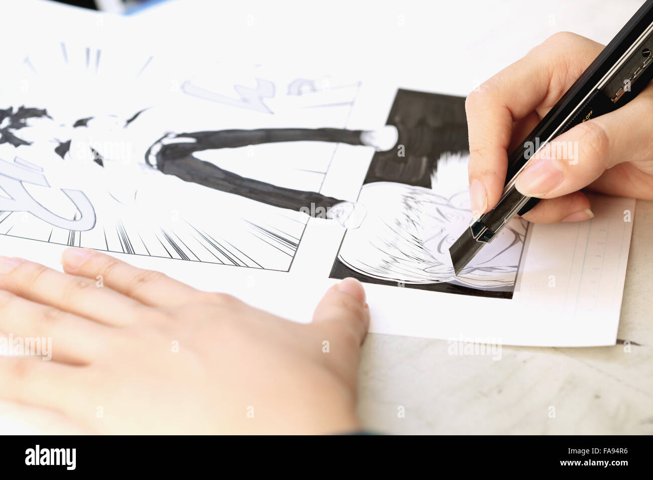 Japanese Manga artist working in the studio Stock Photo - Alamy