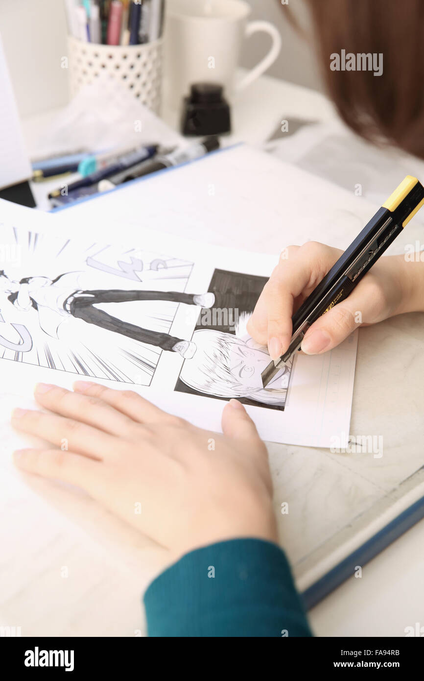 Japanese Manga artist working in the studio Stock Photo - Alamy