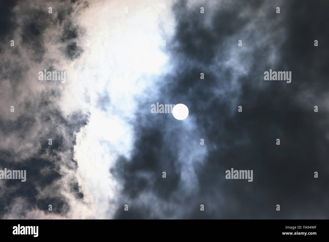 Full moon in a cloudy sky Stock Photo - Alamy